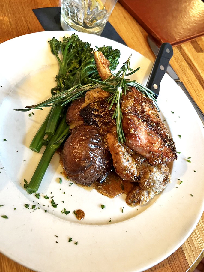 A stuffed pork chop that's dressed to impress, complete with rosemary crown and vegetable courtiers. Photo credit: Alice E.