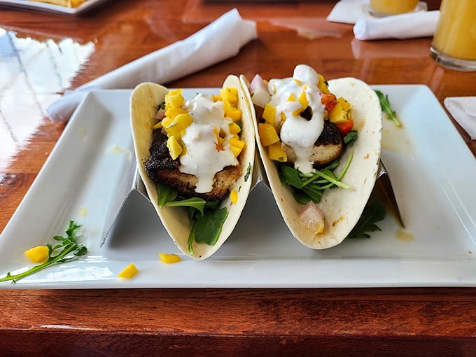 Fish tacos with a Maine accent: fresh catch topped with mango salsa and a drizzle of creamy sauce.