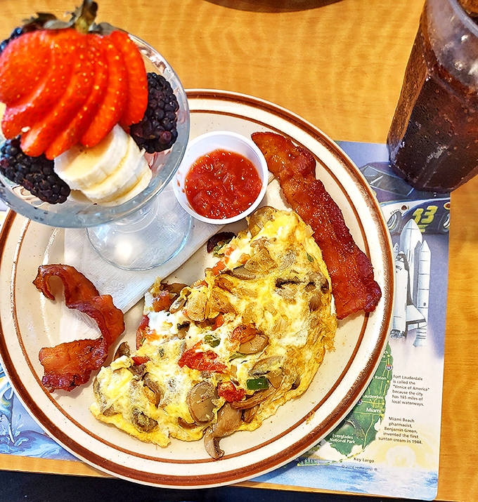 An omelet that's seen more action than a soap opera, paired with bacon crispier than fall leaves. Now that's a power breakfast! Photo credit: Anette Mcgee
