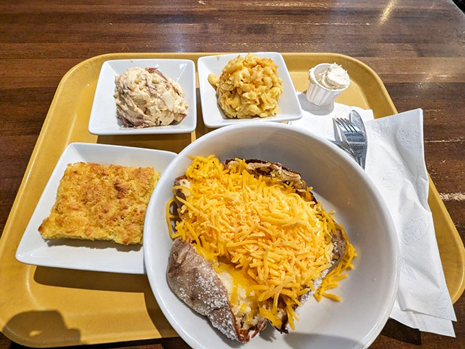 Behold, the baked potato in its final form! It's got more toppings than your neighbor's Christmas light display.