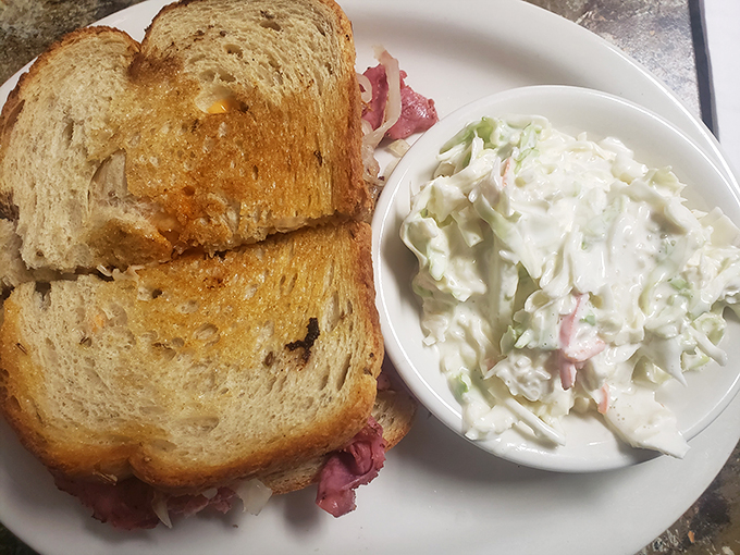 Sandwich perfection achieved! This corned beef on rye is so generous, it's like your Jewish grandmother and Irish grandfather joined forces in the kitchen. 
