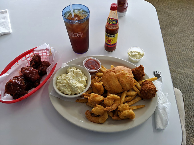 Land meets sea in this flavor-packed feast. With crispy shrimp and a hearty sandwich, it's like a beach vacation for your taste buds &ndash; no sunscreen required.