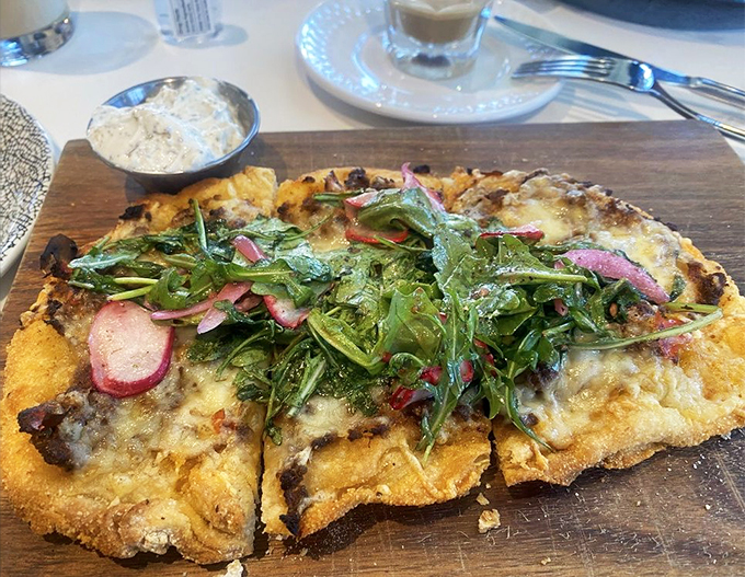 Flatbread that's anything but flat on flavor! This crispy canvas of deliciousness is topped with a garden of goodness that'll make your taste buds dance.