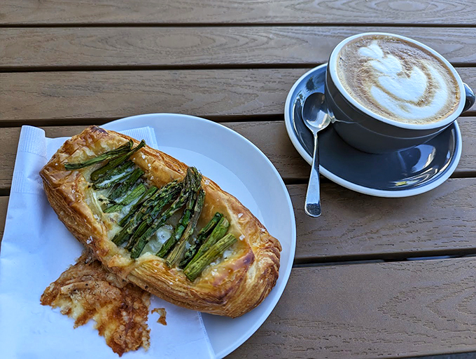 An asparagus tart that makes eating vegetables feel like an indulgence, paired with coffee art worthy of a gallery.