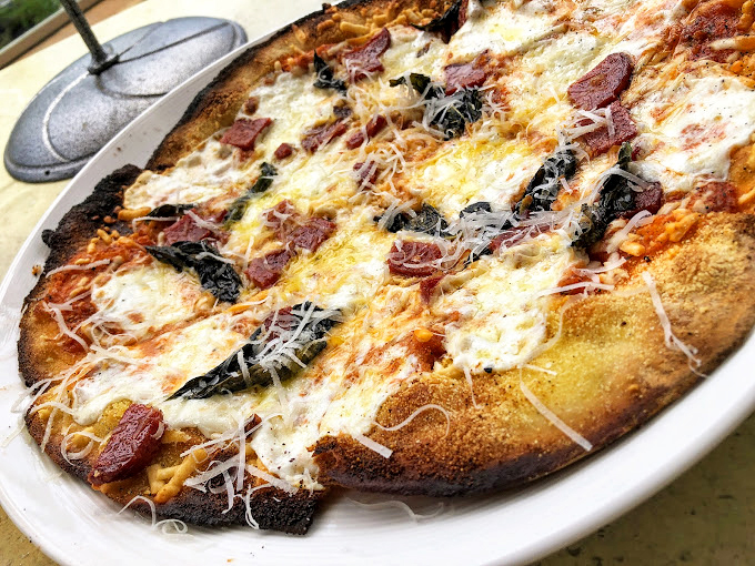 Pizza that's more loaded than a baked potato at a steakhouse! This crispy canvas of deliciousness is a true masterpiece of melty magnificence.