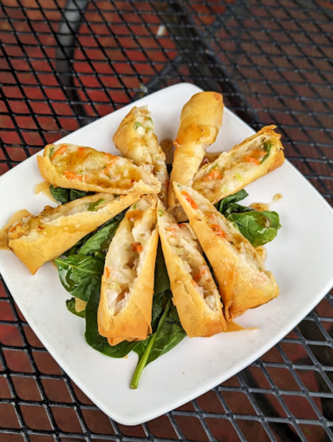 These spring rolls are arranged like the spokes of a delicious wheel, each one promising a perfect crunch-to-filling ratio.