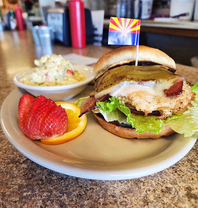 The Arizona burger: where local pride meets gourmet indulgence. It's got more layers than the Grand Canyon and twice the flavor. Photo credit: Beeline Cafe