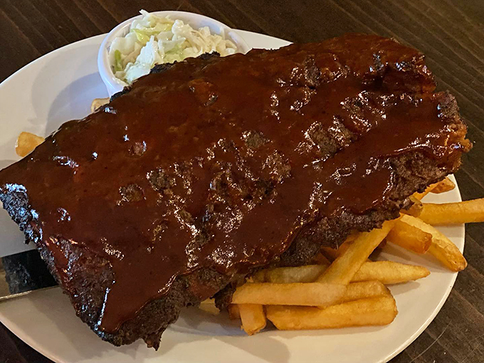 These ribs aren't just falling off the bone - they're staging a delicious rebellion against gravity, glazed in sweet-smoky sauce.