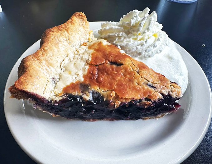 This isn't just pie; it's a slice of Vermont summer. With a flaky crust and bursting berries, it's the kind of dessert that makes you believe in a higher power – the power of pie.