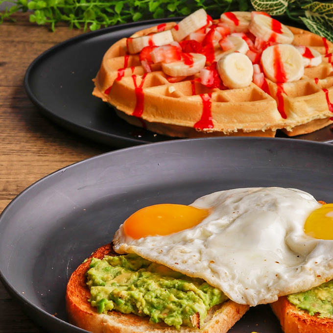 Avocado toast gets the royal treatment with perfectly poached eggs, while Belgian waffles with fresh fruit steal the show. Photo credit: 5th Avenue Cafe