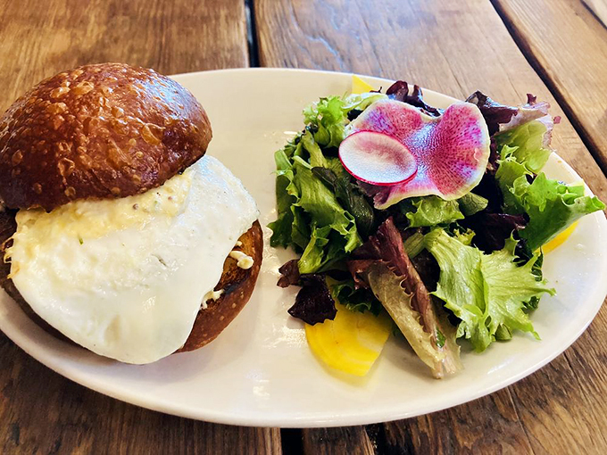 A breakfast sandwich that belongs in the Comfort Food Hall of Fame, paired with a salad for good measure. Photo credit: Genevieve M.