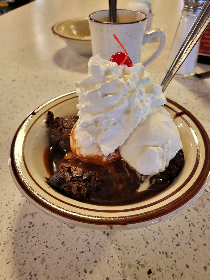 A brownie sundae that's basically a hug for your taste buds. Topped with enough whipped cream to make a cloud jealous.