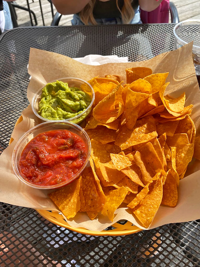 Fresh tortilla chips with house-made salsa and guacamole - the perfect start to any lakeside feast.
