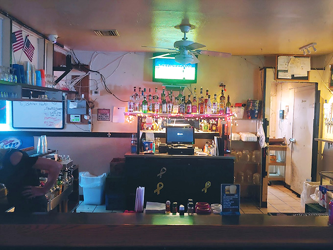 The well-stocked bar sparkles under twinkling lights, promising good times and better conversations ahead. 