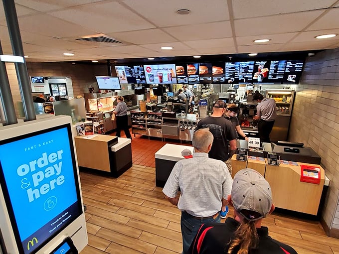 Modern efficiency meets historic charm at the ordering counter, where digital screens complement wooden floors and clean lines. Photo credit: John Pozadzides (John P.)