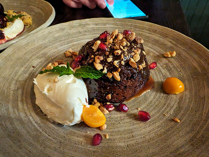 This chocolate dessert with pomegranate seeds isn't just the end of dinner - it's the beginning of a beautiful friendship.