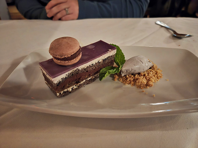 A dessert plate that's basically a chocolate lover's dream come true, complete with a macaron crown. 
