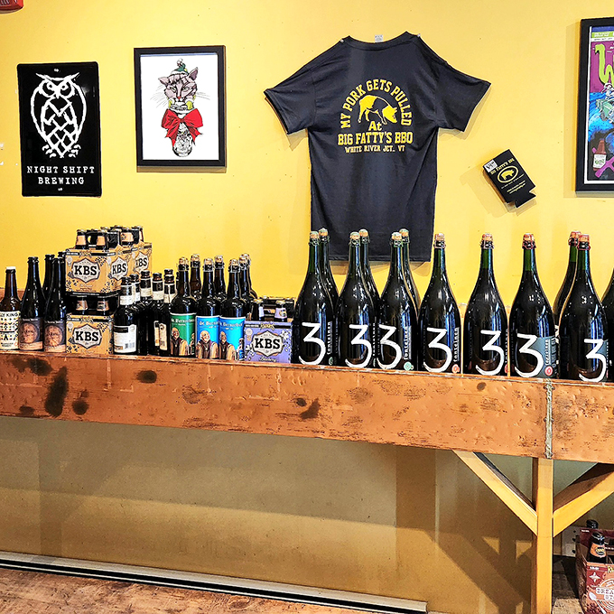 Brew-tiful display! This shelf of craft beers is a liquid library, each bottle telling its own delicious story.