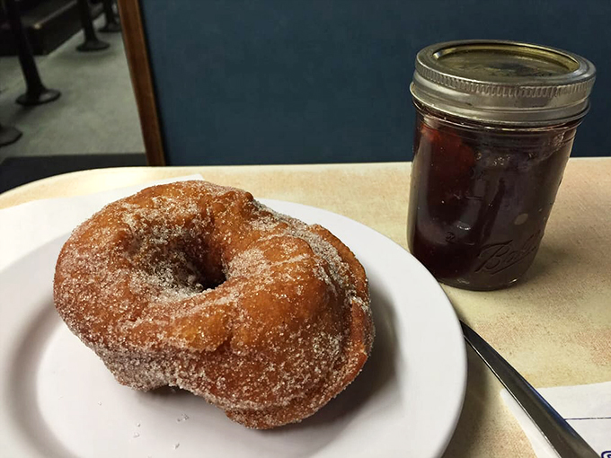 The perfect pair: a sugar-coated donut and a steaming cup of joe. It's breakfast's dynamic duo, ready to kick-start your day!