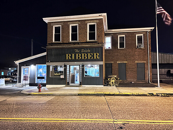 As night falls, the Scioto Ribber glows like a meaty lighthouse, guiding hungry souls to barbecue bliss.
