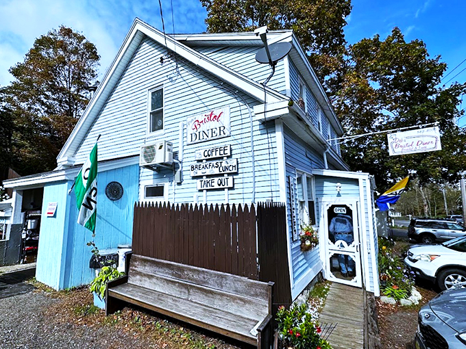 This charming blue building holds more breakfast dreams than a rooster's morning playlist, and twice the warmth.