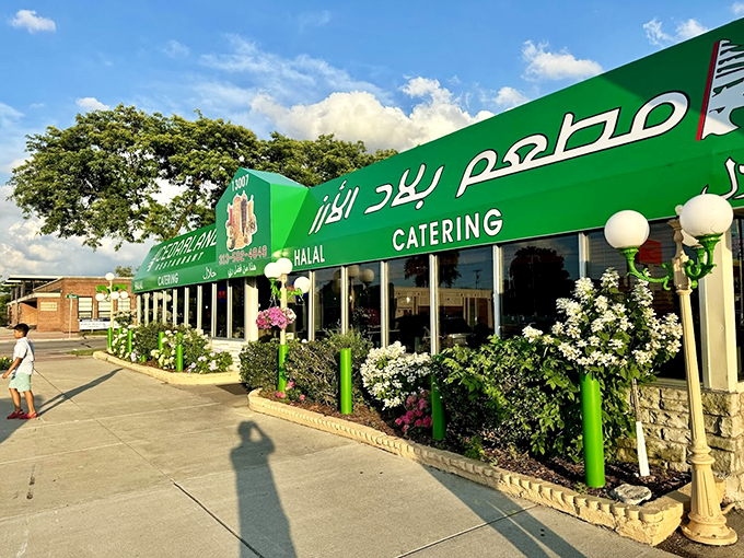 Flowering plants and green accents frame this neighborhood gem, making every visit feel like a warm welcome home.