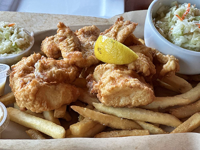 Golden-battered perfection meets hand-cut fries. This isn't just fish and chips - it's a seaside symphony.