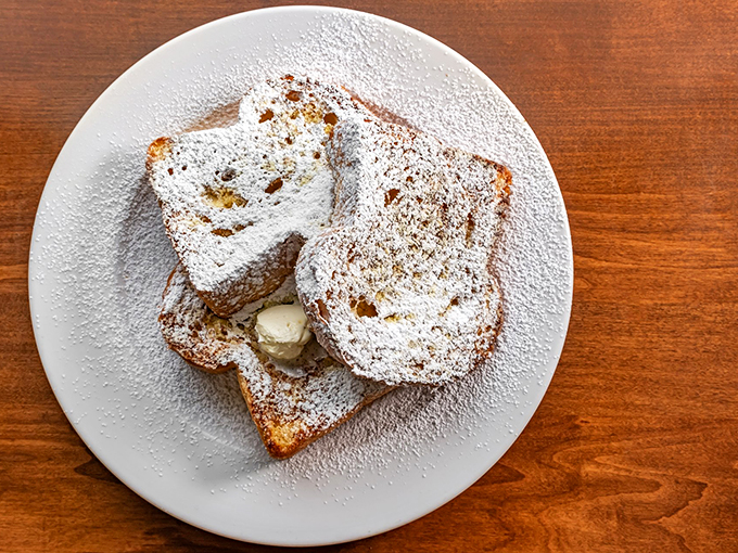Powdered sugar snow on French toast mountain! This breakfast of champions is so decadent, it should come with a warning label: "May cause spontaneous happiness."
