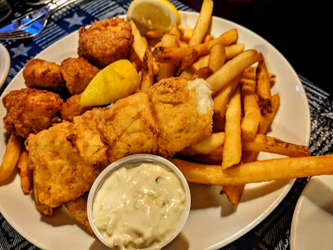 Golden-fried seafood and crispy fries &ndash; the kind of plate that makes you wish you had a second stomach. Photo credit: John K.