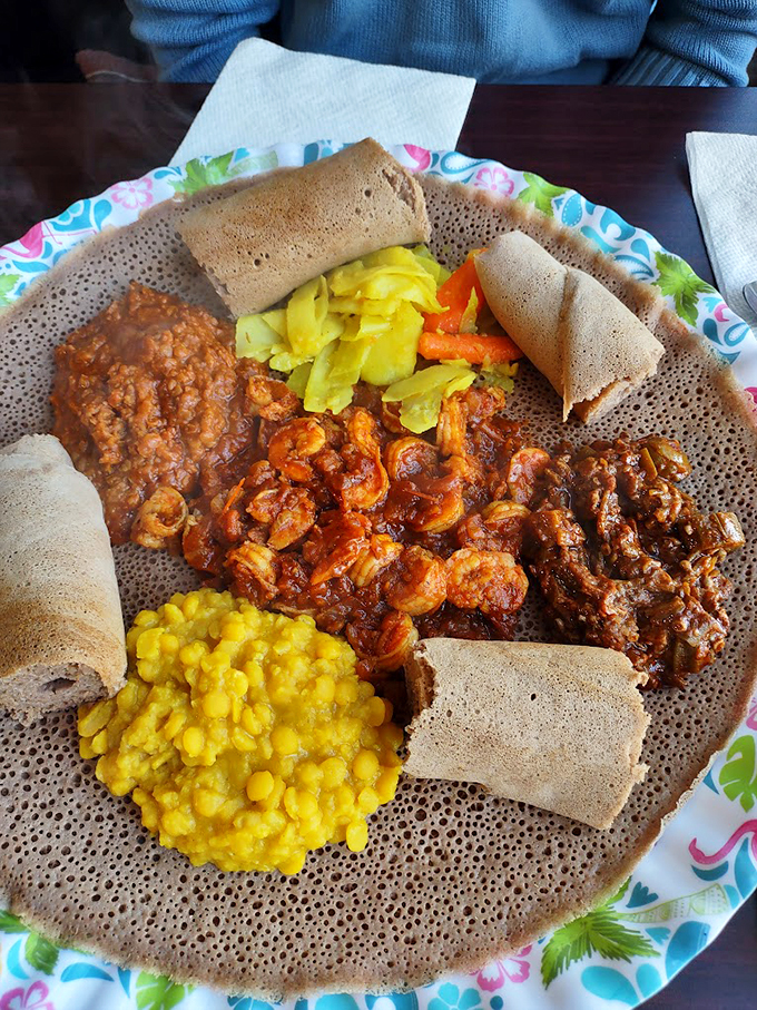 A feast for both eyes and appetite: multiple dishes create a colorful mosaic on injera, proving that the best plates are meant for sharing.