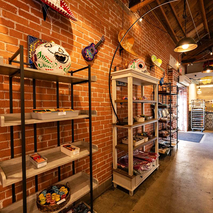 Day of the Dead masks and guitars adorn exposed brick walls, creating a cultural gallery that celebrates Mexican heritage.