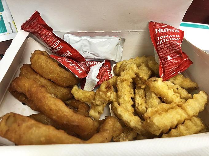 A box of pure comfort food joy - where crispy fries and golden rings meet their destiny with Hunt's ketchup.
