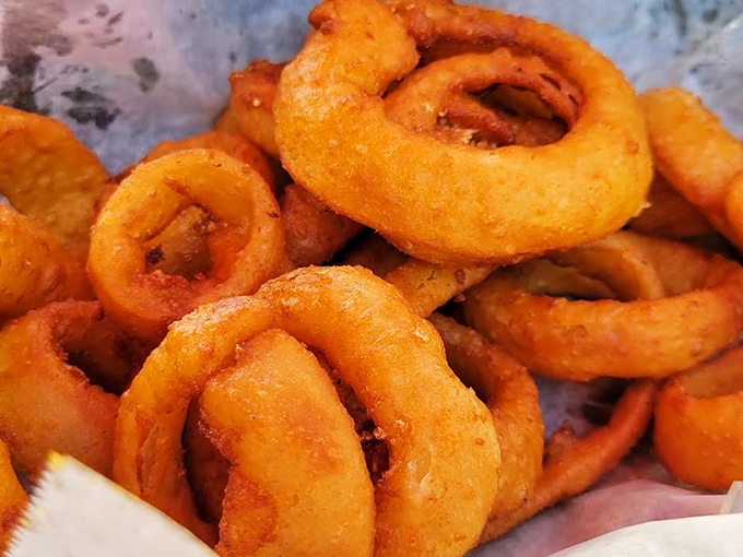 These aren't just onion rings - they're golden halos of crispy perfection that'll make you believe in deep-fried heaven.