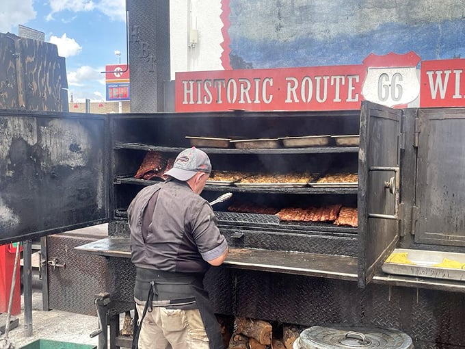 Smoke signals never smelled so good! This outdoor BBQ setup is like a beacon of deliciousness calling all hungry travelers home.