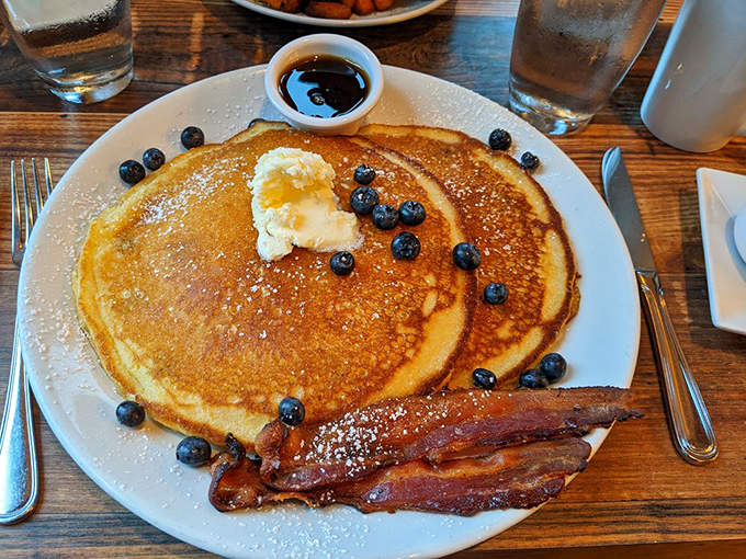Golden pancakes with fresh Maine blueberries and crispy bacon - breakfast doesn't get more perfect than this.