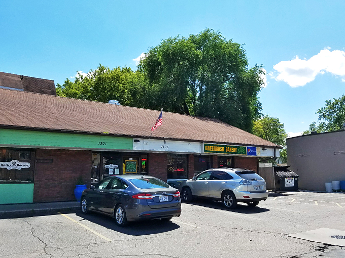 Parking lot filled with cars of smart cookie lovers. They know where to get their fix of circular happiness!