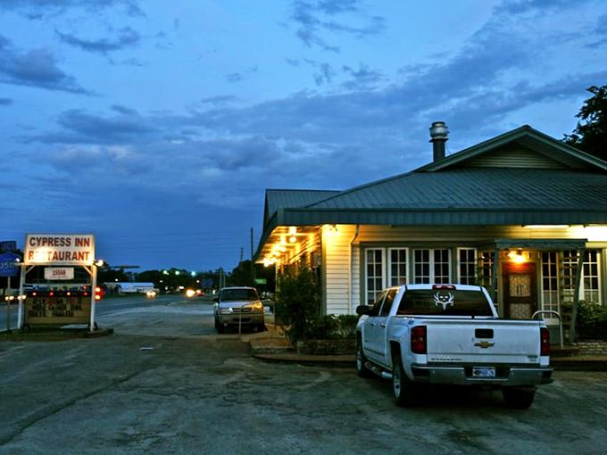 As dusk settles, the warm glow of Cypress Inn beckons like a lighthouse for hungry souls.