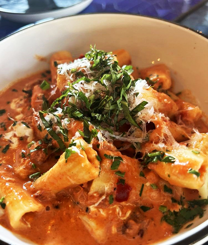 Creamy, dreamy pasta perfection topped with fresh herbs - comfort food elevated to an art form.