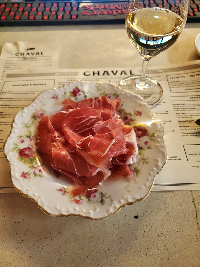 Prosciutto so thinly sliced, it's practically transparent. Paired with a crisp white wine, it's the kind of simple luxury that makes life worth living.