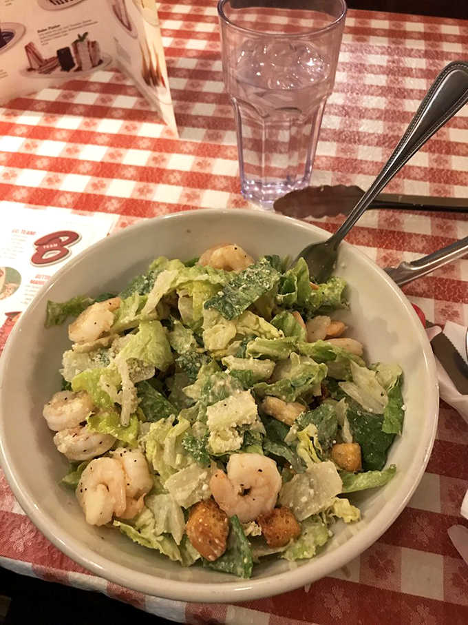 Who says you can't have it all? This Caesar salad brings the crunch, while those shrimp add a touch of surf to your turf. It's the best of both worlds, Italian-style!