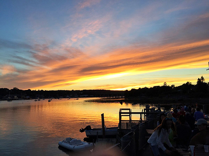 A Belfast sunset paints the harbor in golden hues, proving that even the end of day here is something special. Photo credit: @scottp271
