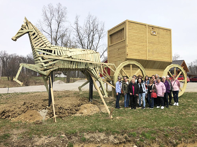 "I told you it wasn't just horsing around!" This wooden wonder draws crowds faster than you can say "raise the barn."