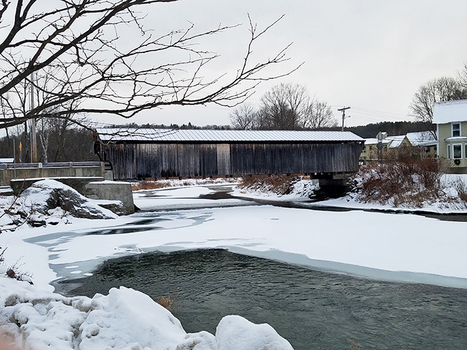 Winter wonderland, meet historical landmark! The Waitsfield Covered Bridge dons its snowy coat, ready for its close-up in Vermont's seasonal photo album.