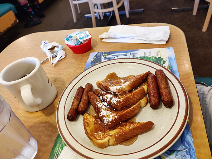 The breakfast trifecta: French toast, sausage links, and a steaming cup of joe. It's like hitting the jackpot before your day even begins! Photo credit: Christine Cillo