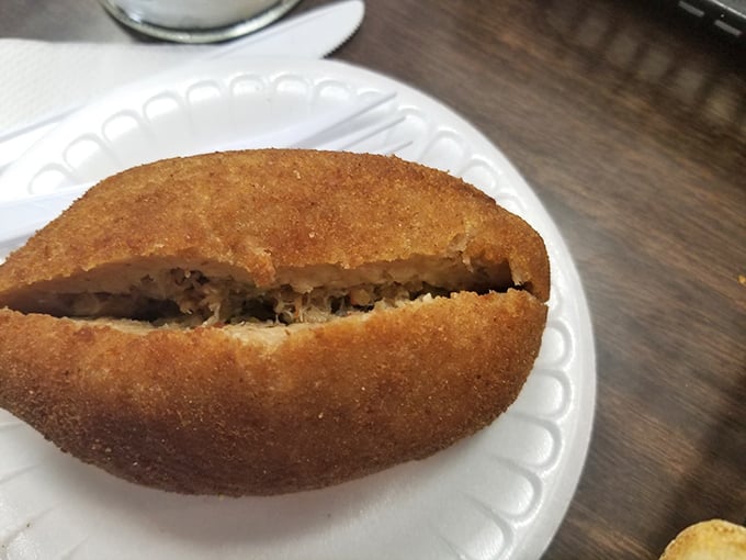 Deviled crab: where seafood meets comfort food. It's like a warm, crispy hug from the ocean. Photo credit: Manolo Hernandez