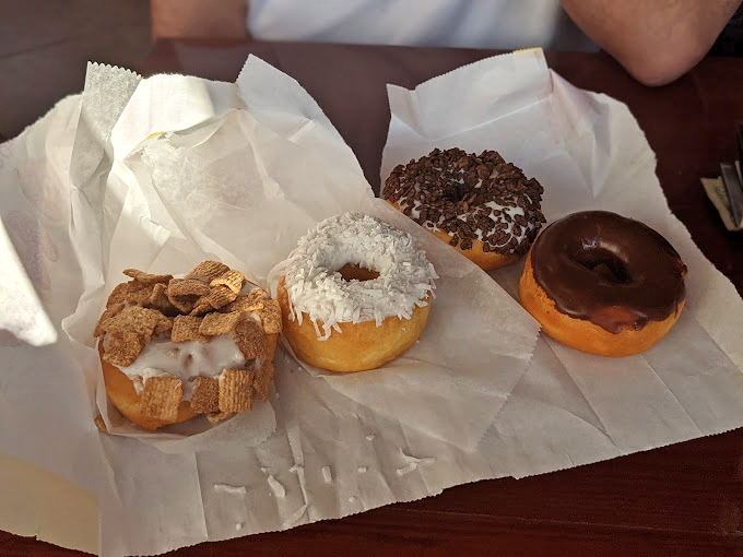 From classic glazed to gourmet creations, these donuts are like the cast of a delicious Broadway show.