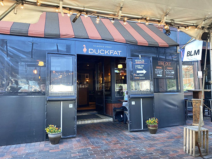 Step right up to flavor town! This entrance is like a portal to a world where everything's better with duck fat.