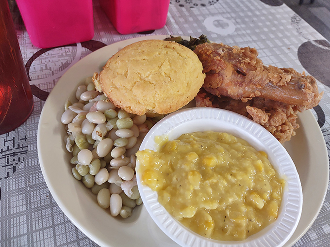 The holy trinity of Southern cuisine! Fried chicken, creamy sides, and a golden biscuit - it's a match made in comfort food heaven. Photo credit: Susan Petrey Carriker