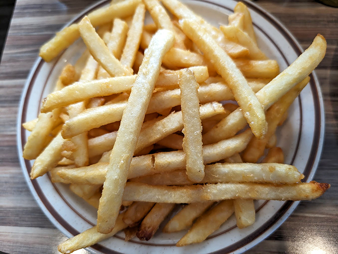 Fries that are crispier than your grandpa's jokes and more golden than a summer sunset. Ketchup optional, but highly recommended! Photo credit: Bryan