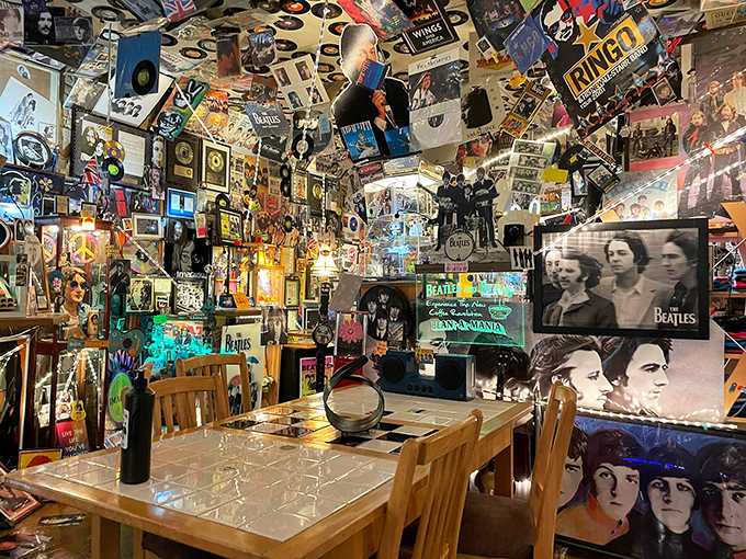 A cozy corner where every table feels like a front-row seat to music history, complete with your favorite caffeine companion.